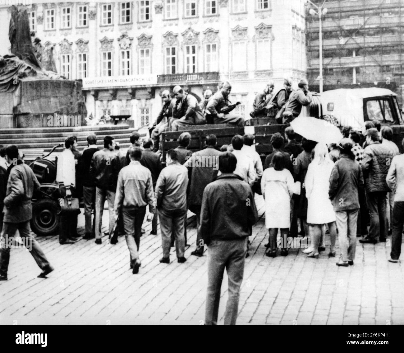 Prague Spring 1968 Silent citizens look on as a Russian troop-carrier ...