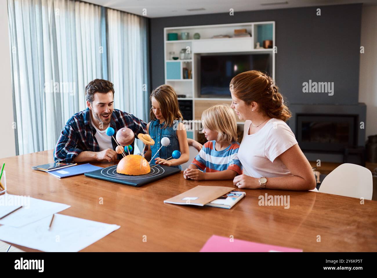 Parents, children and science project for school in home, building ...