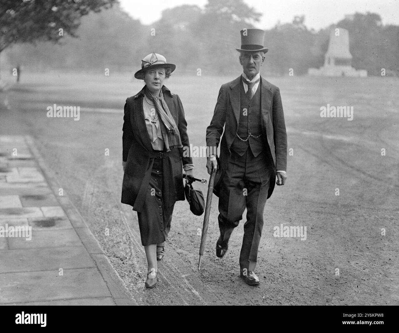 Mr and Mrs Chamberlain arriving at the Treasury on 27 June 1934 ...