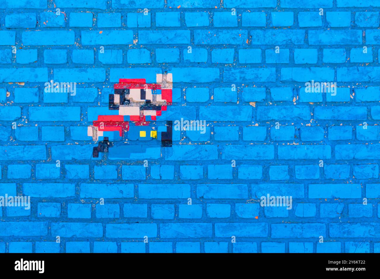 Mario Bros on a blue brick wall Stock Photo - Alamy
