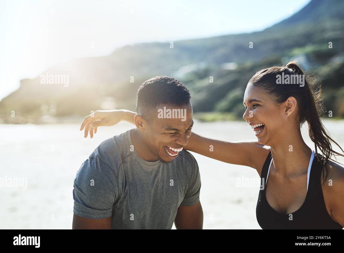 Laughing, health and couple on beach for start of training, fitness and ...