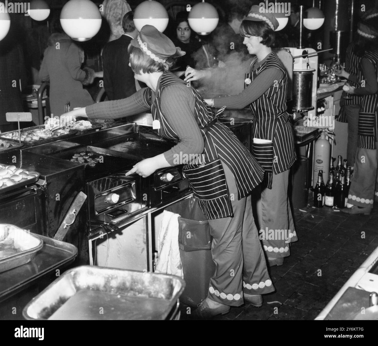 Chips with Everything - Young waitresses serve food to busy lunch time ...
