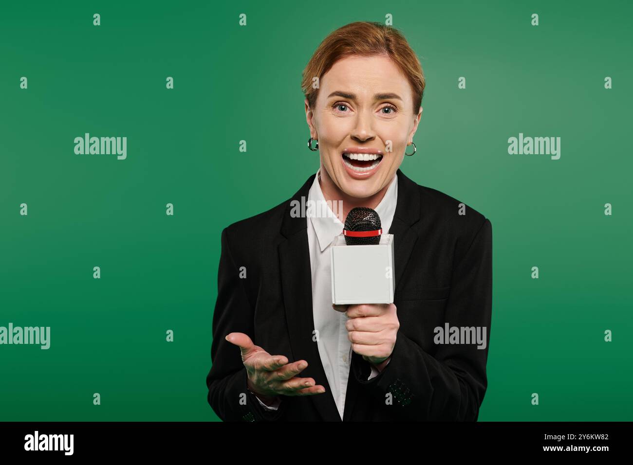A vibrant TV presenter in elegant black attire interacts ...