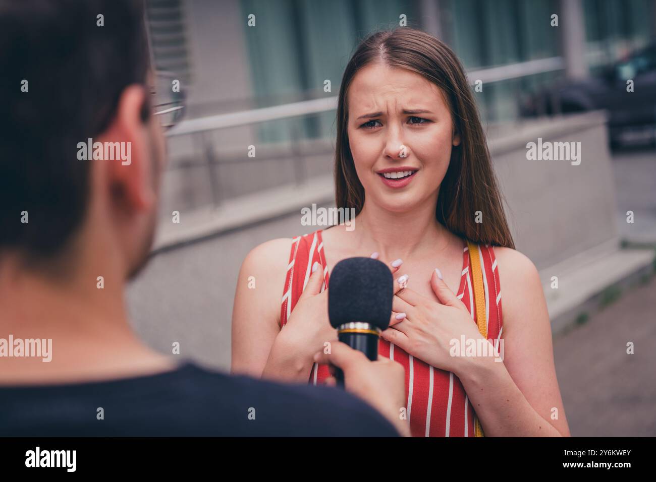 Photo of lovely charming girl giving interview answering to journalist ...