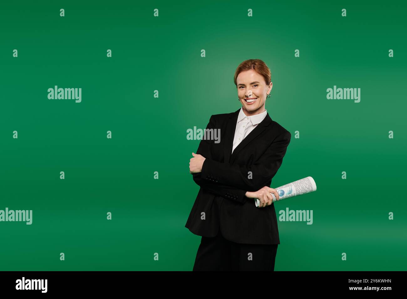 The TV presenter, dressed in stylish black suit, poised to engage the ...