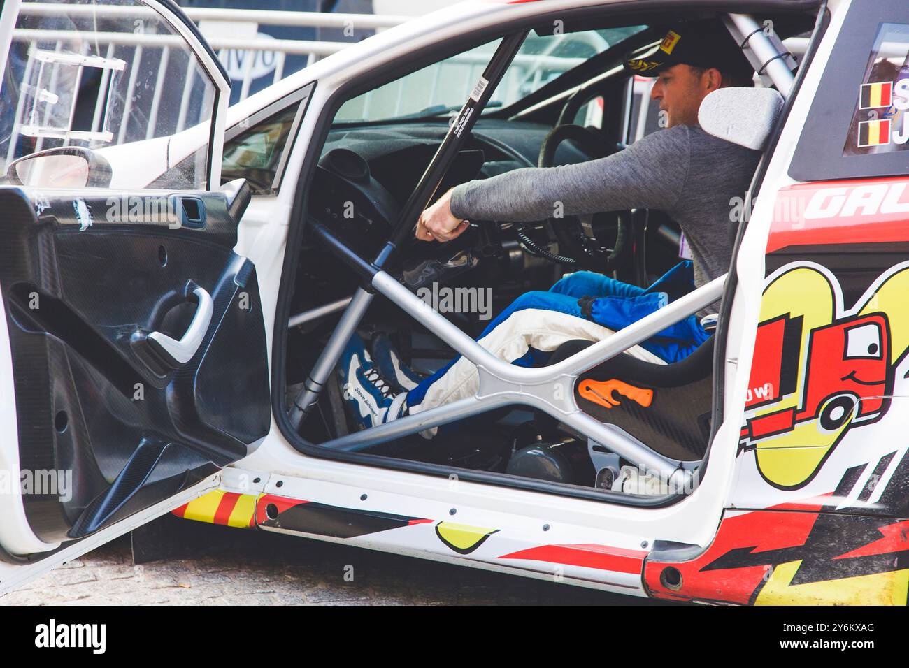 Car race. Pilot at the wheel, protection system Stock Photo - Alamy