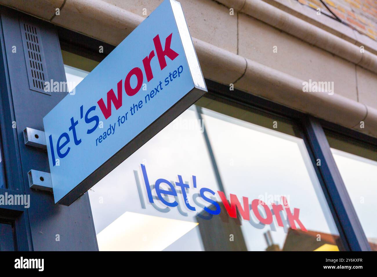 Let'sWok brand sign Stock Photo - Alamy