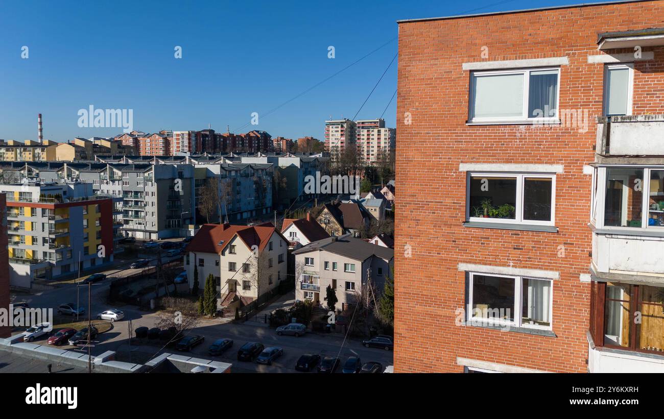 A modern brick apartment building with multiple balconies, showcasing ...