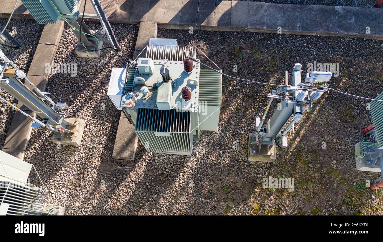 An industrial electrical substation featuring various transformers ...
