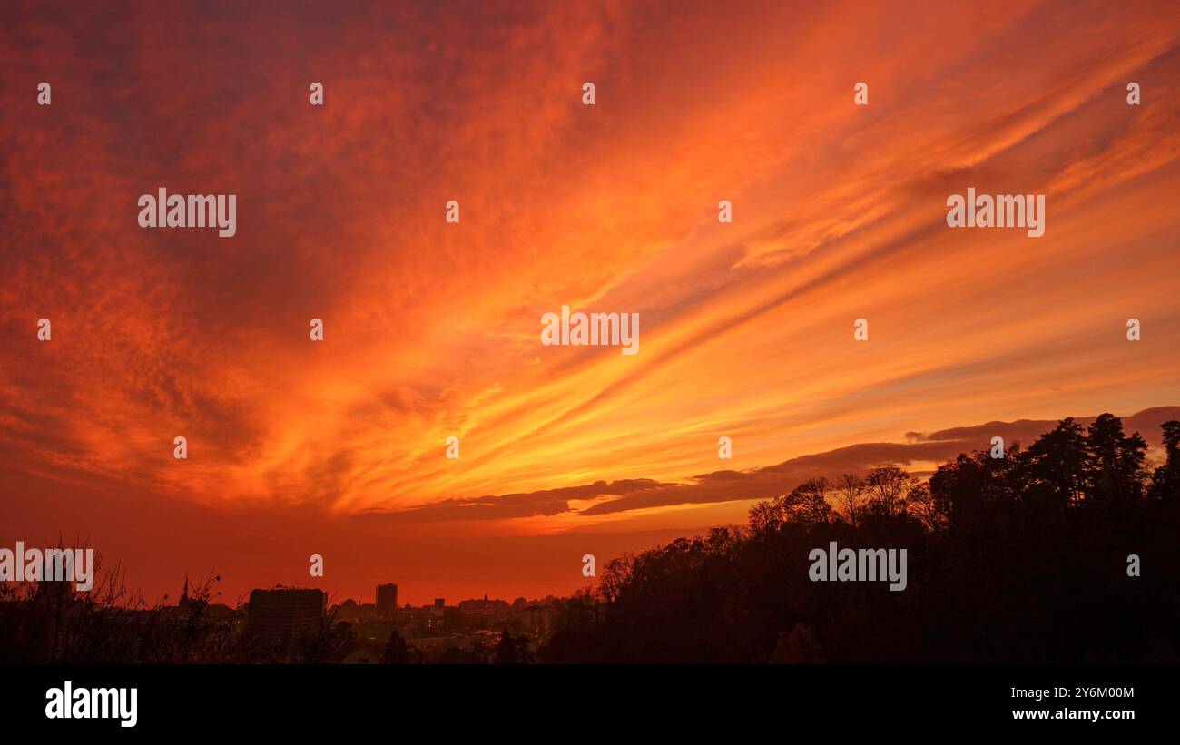 Sunset from Lausanne with an orange sky Stock Photo - Alamy