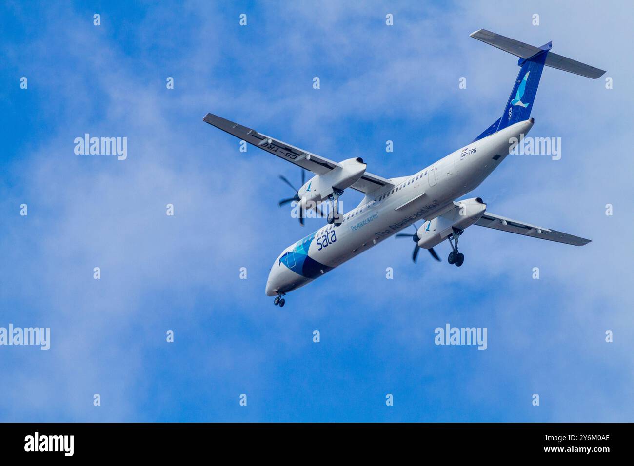 Sata Airplane underside in the sky Stock Photo - Alamy