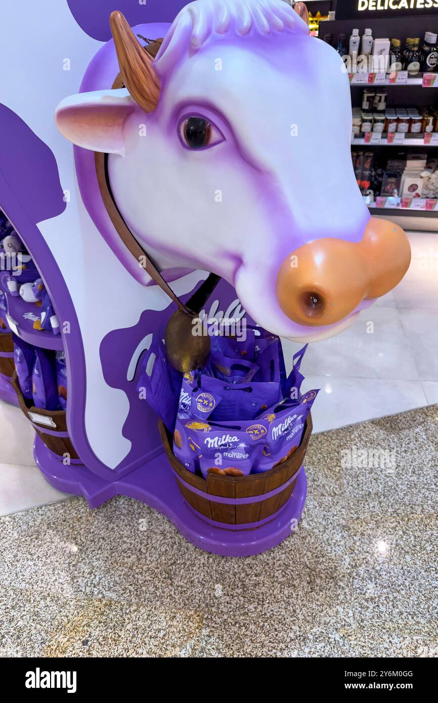 Milka display in the shape of a purple cow Stock Photo - Alamy