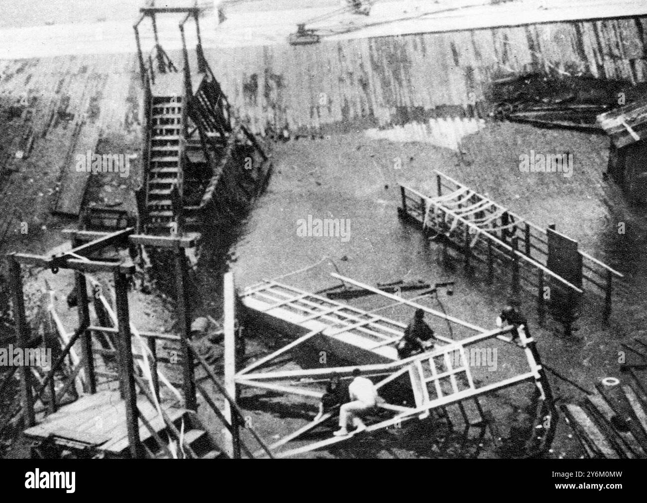 Showing at Yokohama cling to wrecked timber structures A photograph ...