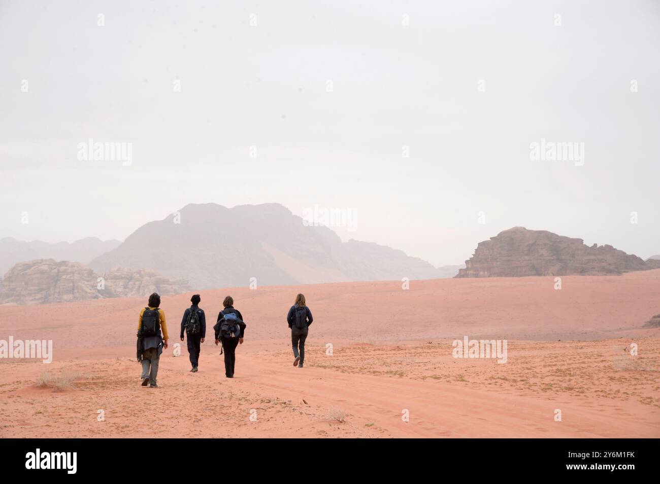 Jordan, Middle east, Wadi rum desert, a group of european hikers walk ...