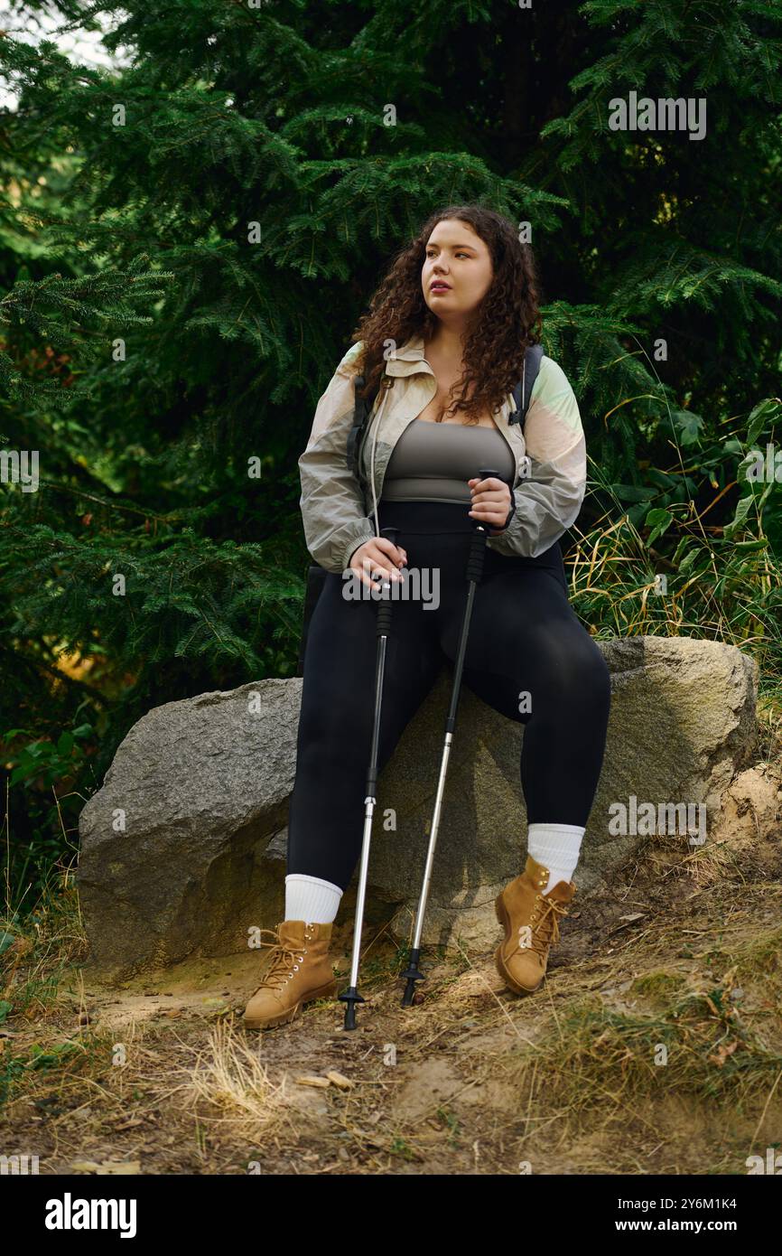 A confident plus size woman enjoys a peaceful moment in a lush green ...