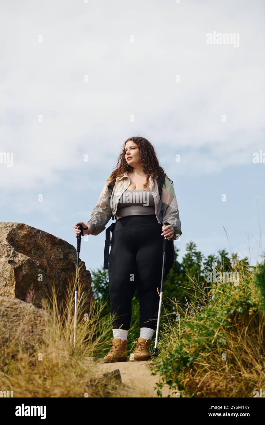 A confident plus size woman explores a lush field, soaking in the ...