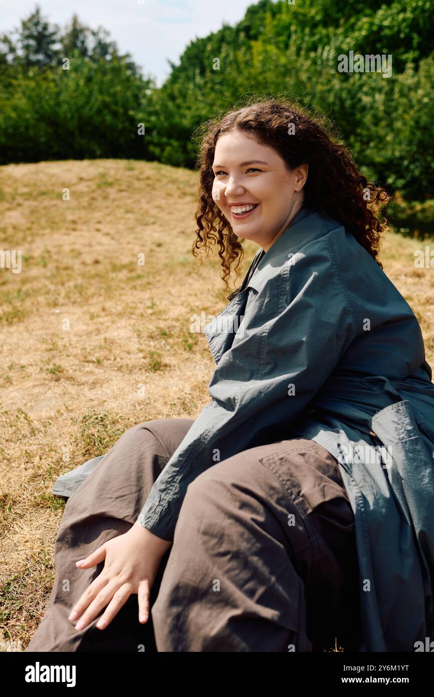A beautiful plus size woman enjoys a sunny day in nature, radiating ...