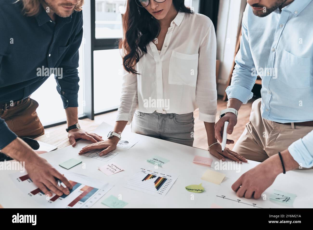 Choosing the right direction. Close up of young confident business ...
