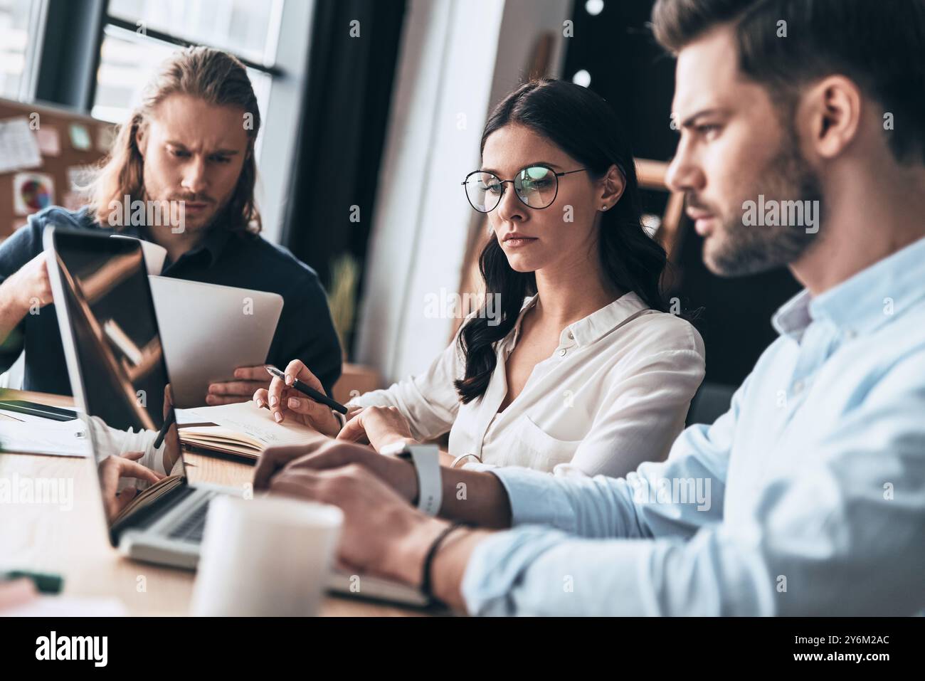 Ready to work hard. Young modern colleagues in smart casual wear ...