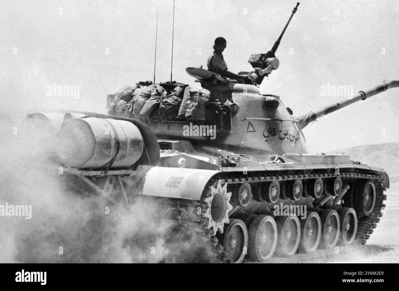 6 Day War Jordan - Israel Border: In a cloud of desert dust, a heavily ...