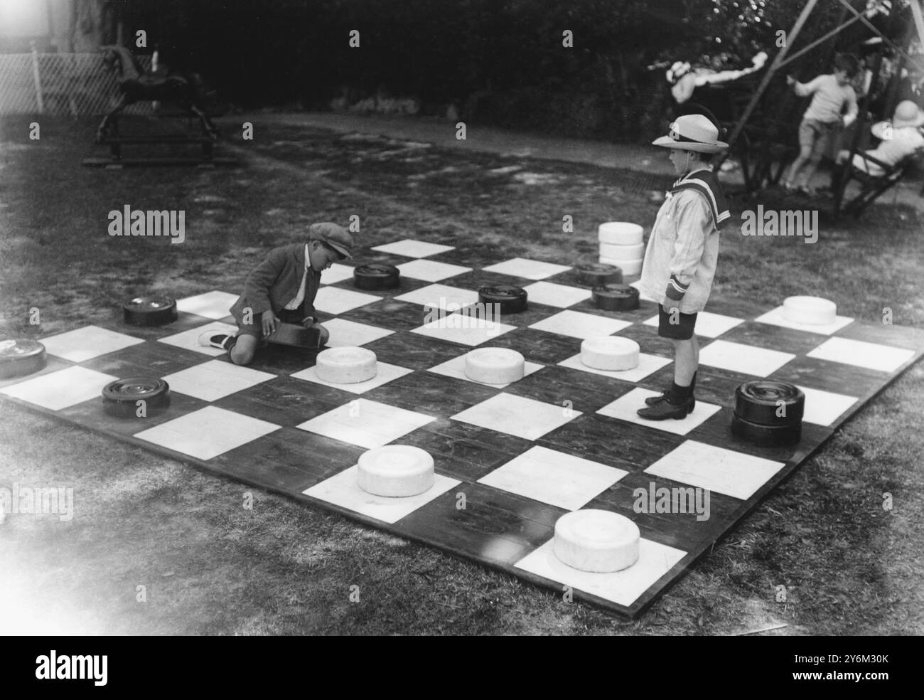 Two boys playing Giant Draughts in Devonshire Park, Eastbourne 1920 ...