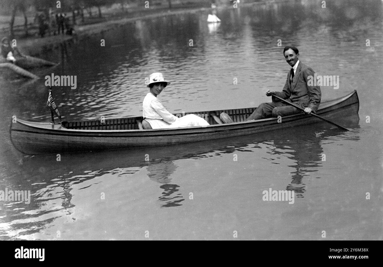 Motor Cycle Canoe. Accommodation for three is provided. On the river. A ...