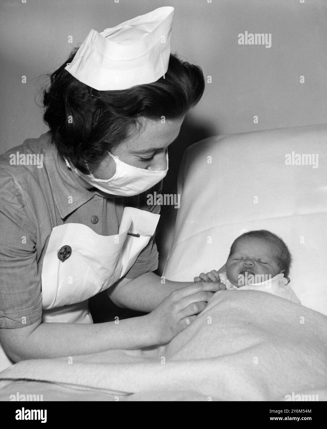 This litle girl, one of the first babies of 1958, is pictured at Queen ...