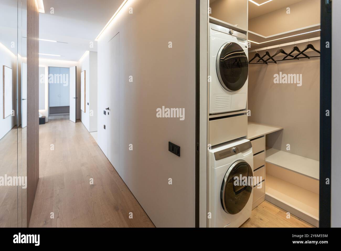 a laundry room with washer, dryer and washing machine on the wall in ...