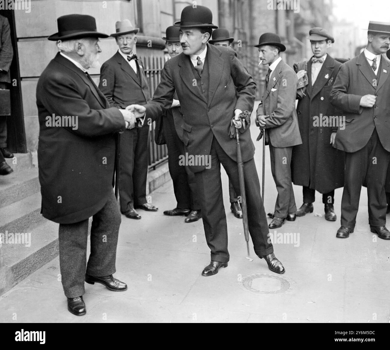 Mr H. Charles Woods at Marlborough Street Police Court shakes hands ...