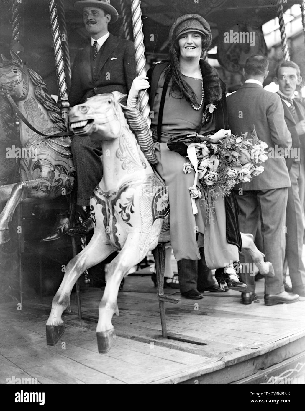 Lady Irene Curzon on the roundabout at the Gayton Fair and Fete which ...