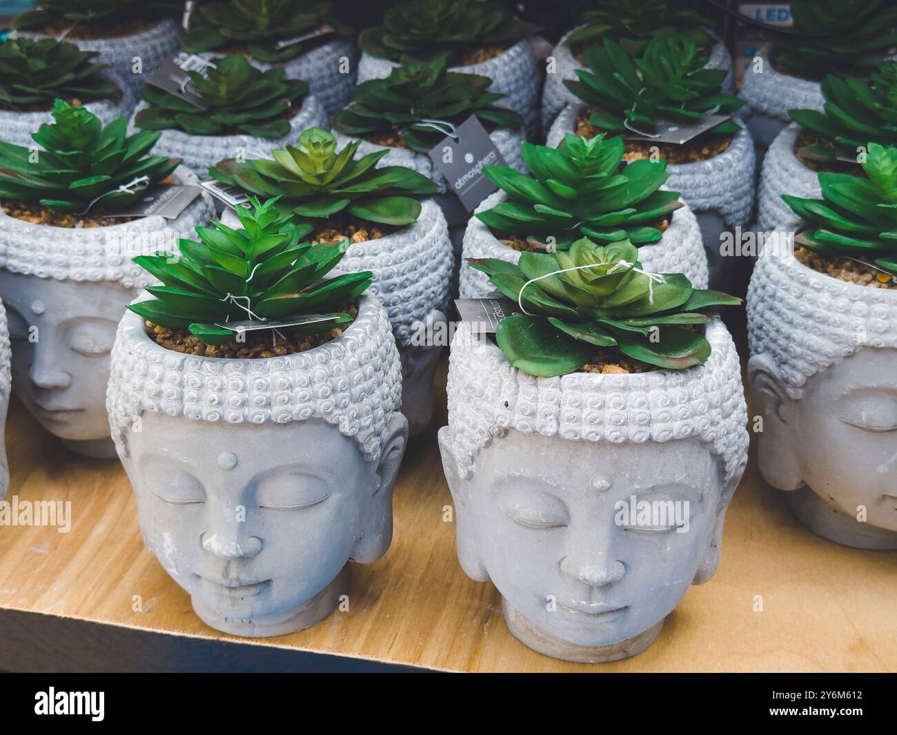 Sale of oriental Zen statue in a garden center Stock Photo - Alamy