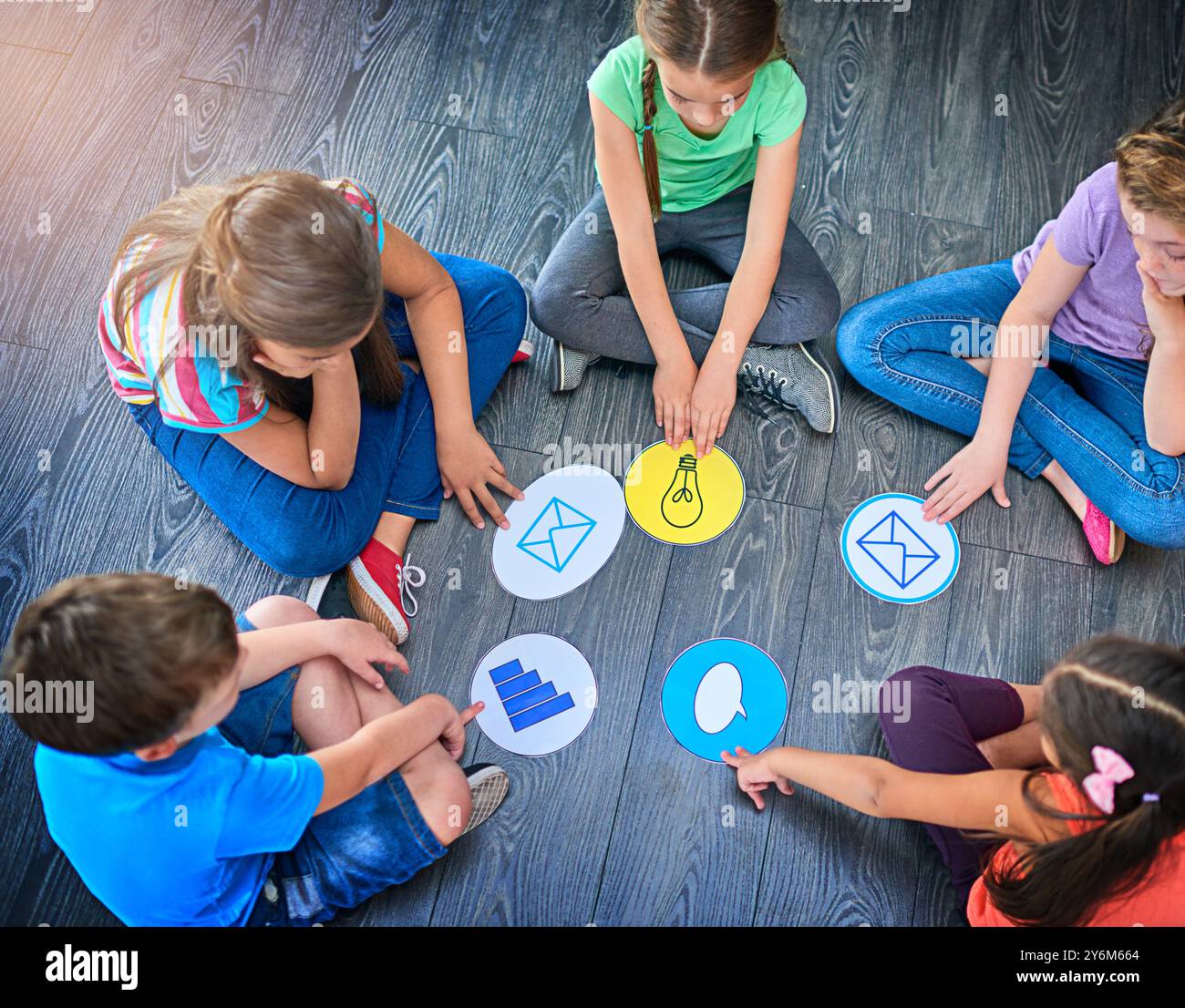Children, students and playing game on floor with communication icons ...