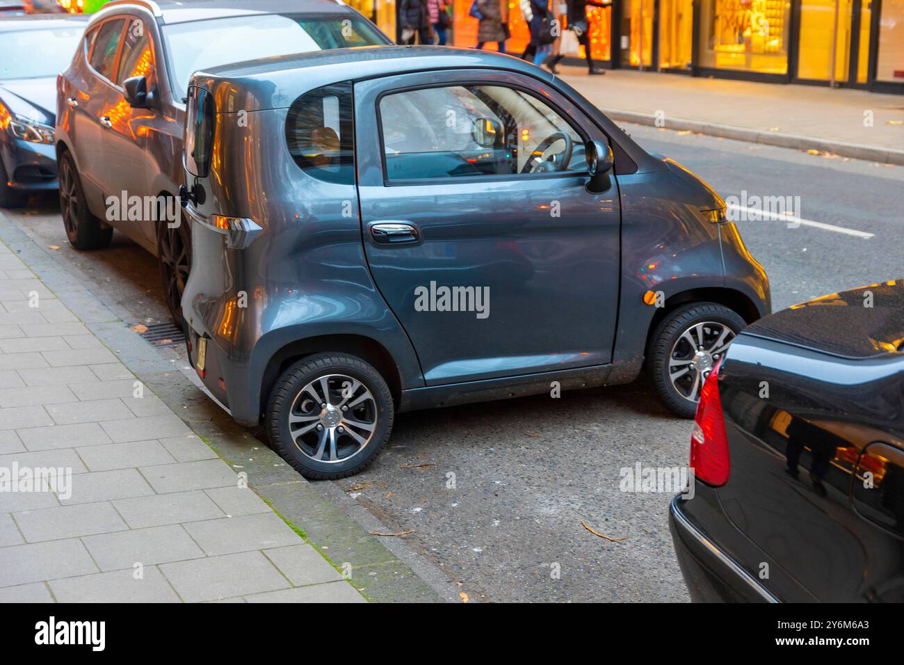 Cart, parked the other way between two cars Stock Photo - Alamy