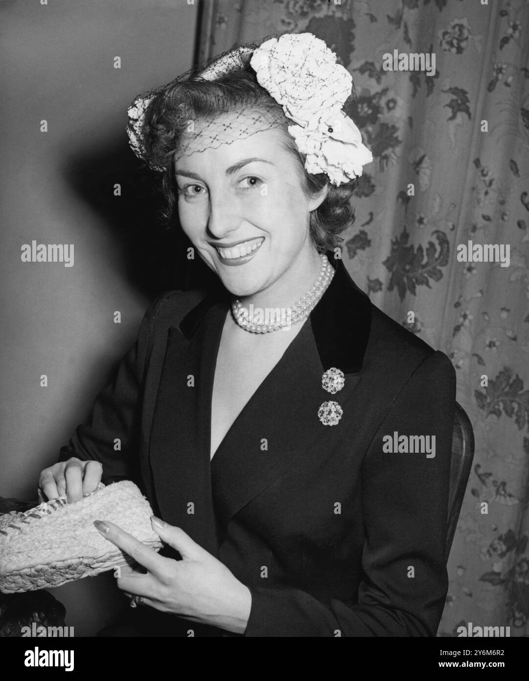 27 December 1951 Dame Vera Lynn packing a pair of Raffia slippers ...