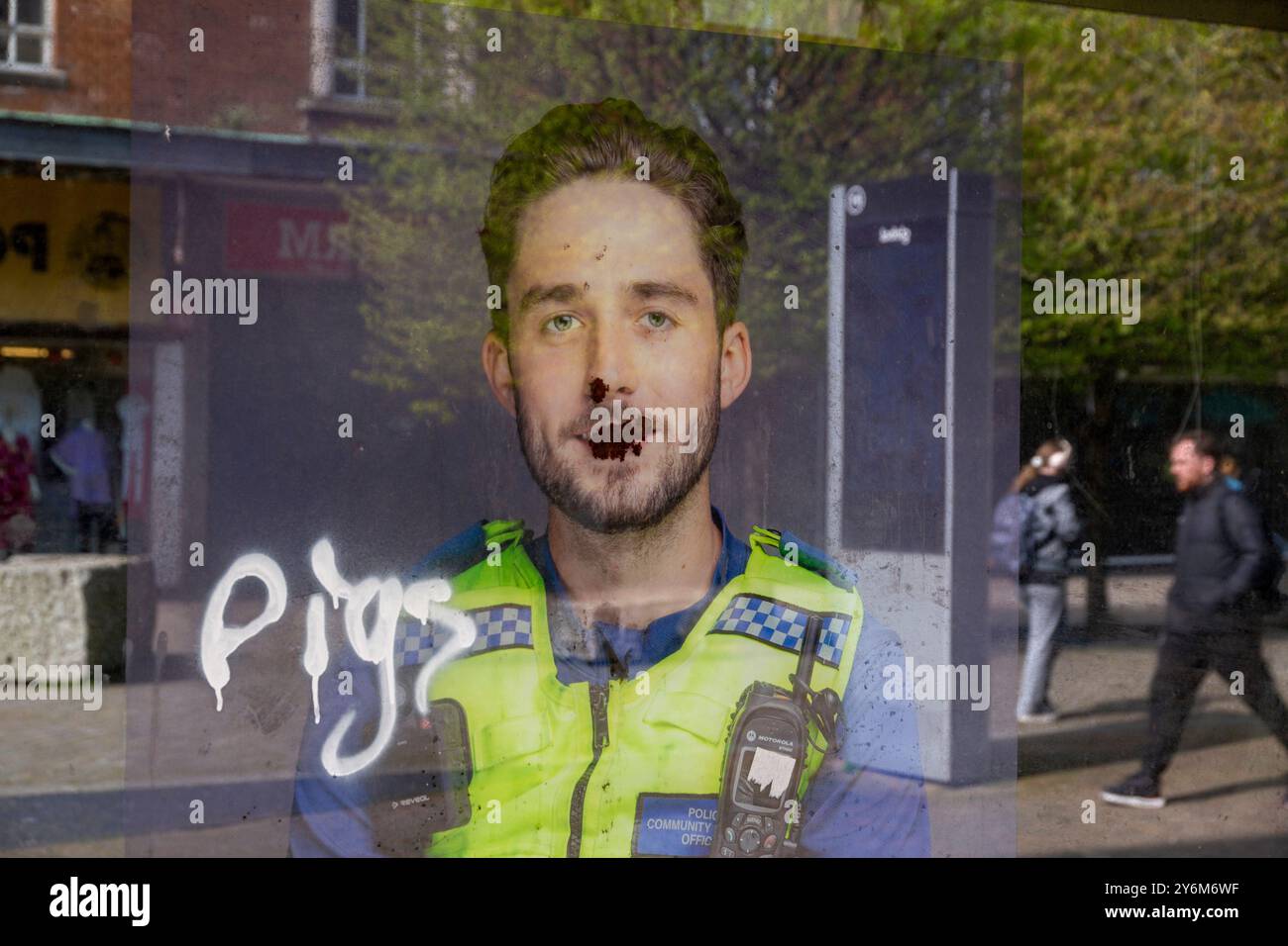 United Kingdom, England. Police. Tags on policeman's face on an ...