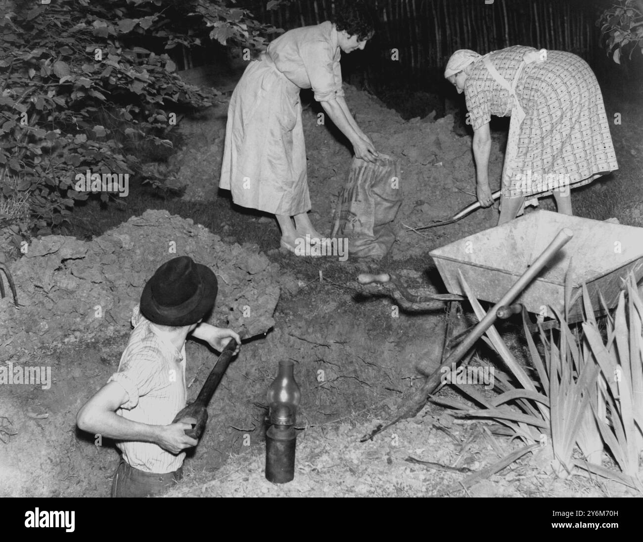 Householders were kept busy even at night. By paraffin lamplight, they ...