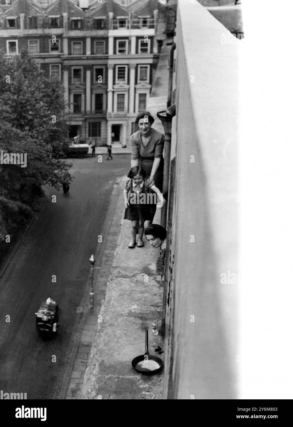 Sixty feet above a milkman in the road below, four year old Sylvia ...