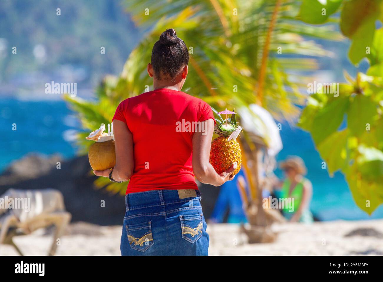 Dominican Republic, Dominican woman serving cocktails Stock Photo - Alamy