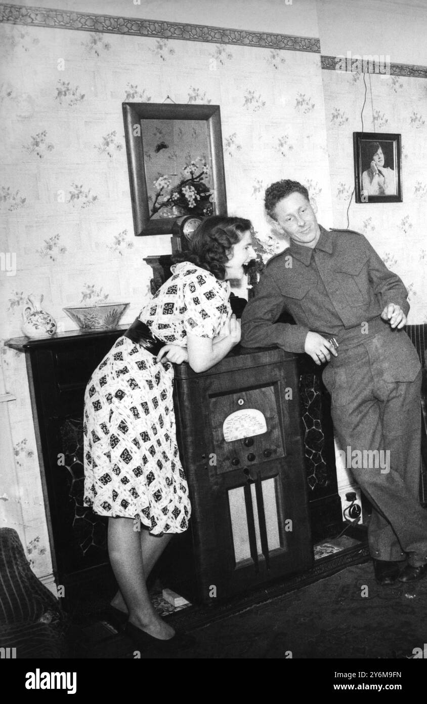 Listening to the radio in WWII Stock Photo - Alamy