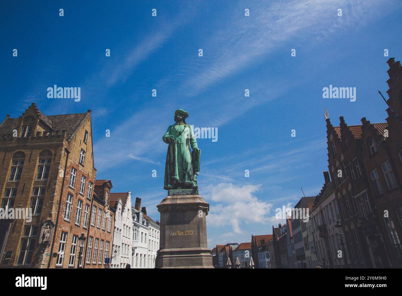 Europe, Belgium, Bruges. Statue of the Flemish painter Jan Van Eyck ...