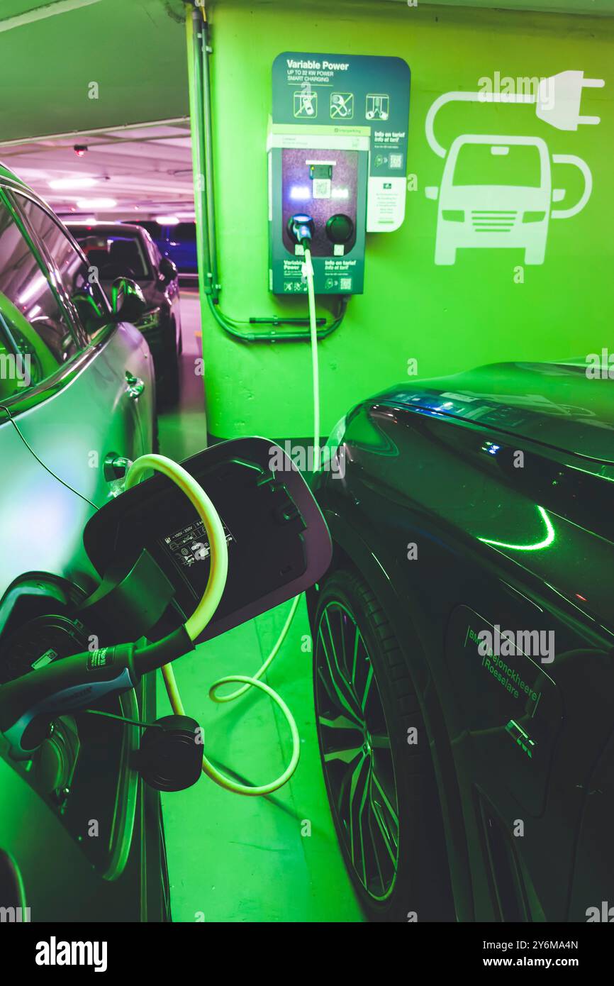 Electric car charging station, in an underground car park Stock Photo ...