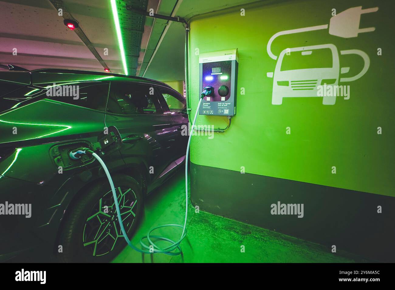 Electric car charging station, in an underground car park Stock Photo ...