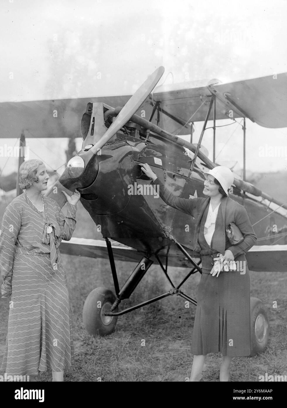 Reading Aero Club's "At Home" Mrs E. Bettye Showing her plane to Mrs G ...