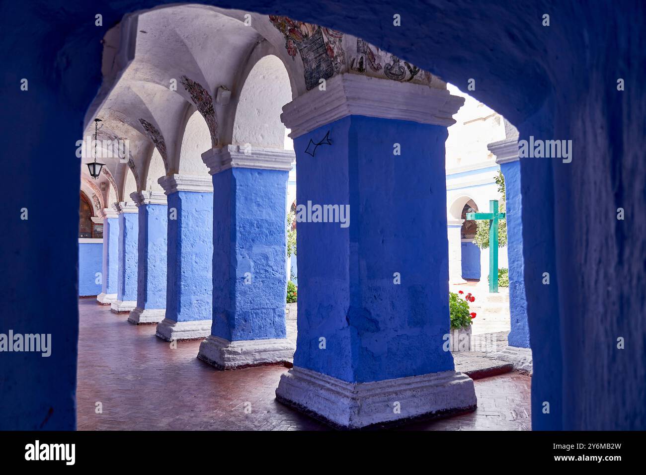 Vibrant blue columns and arches create a serene atmosphere in the ...