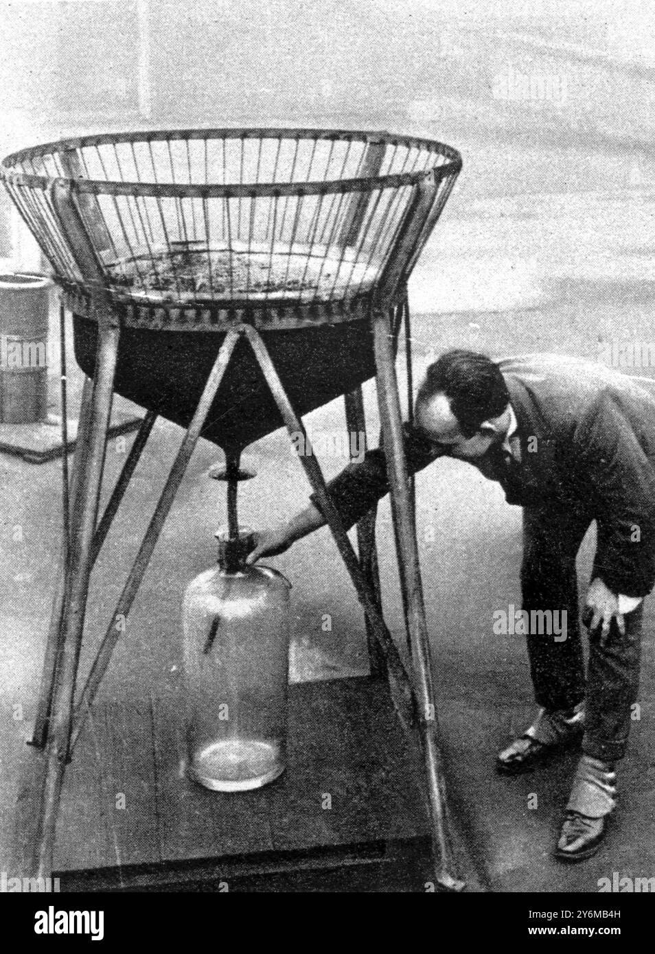 Sampling London fog: Inserting the tube of a soot-gauge into a bottle ...