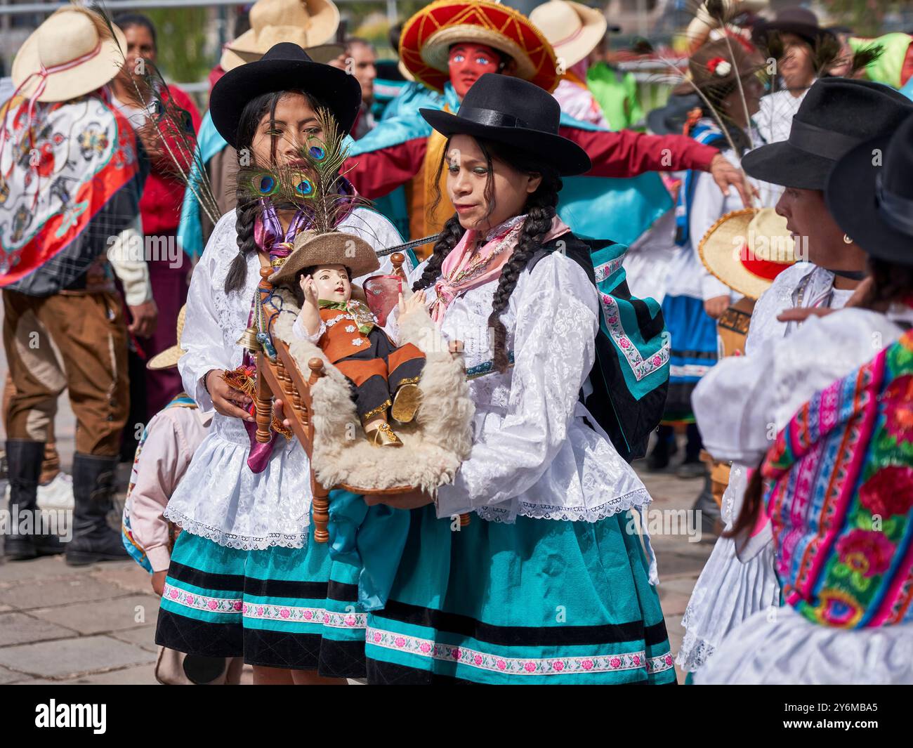 Men and women in traditional Peruvian attire participate in a vibrant ...