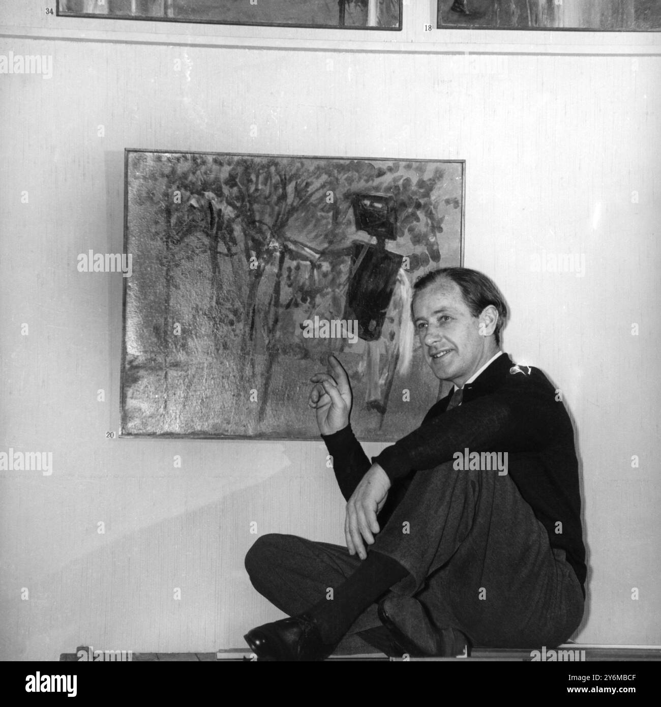 Australian artist Sidney Nolan points at his painting "Ned Kelly and ...