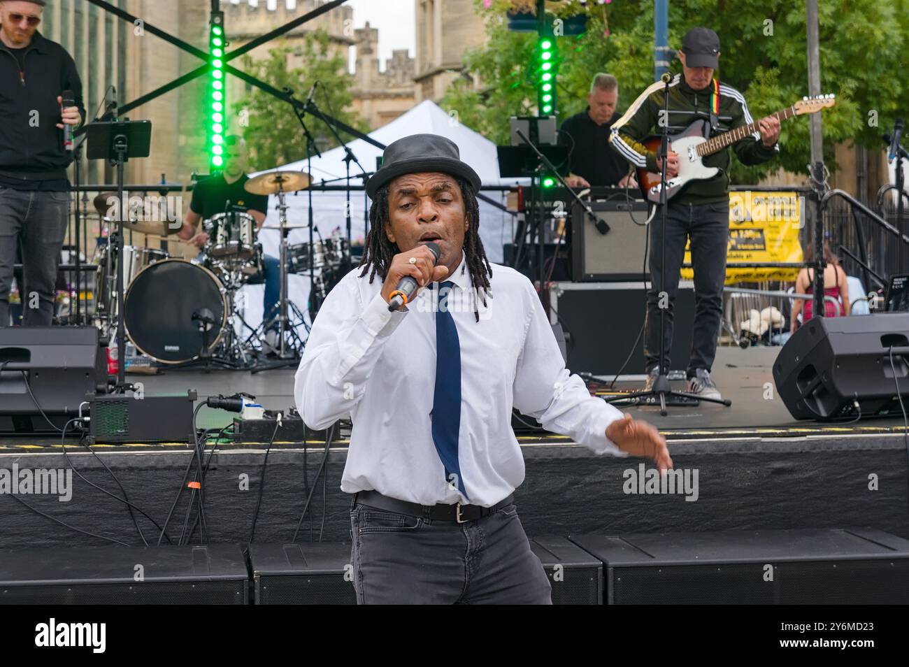 Singer performing with a band on stage at the Reggae and Ska festival ...