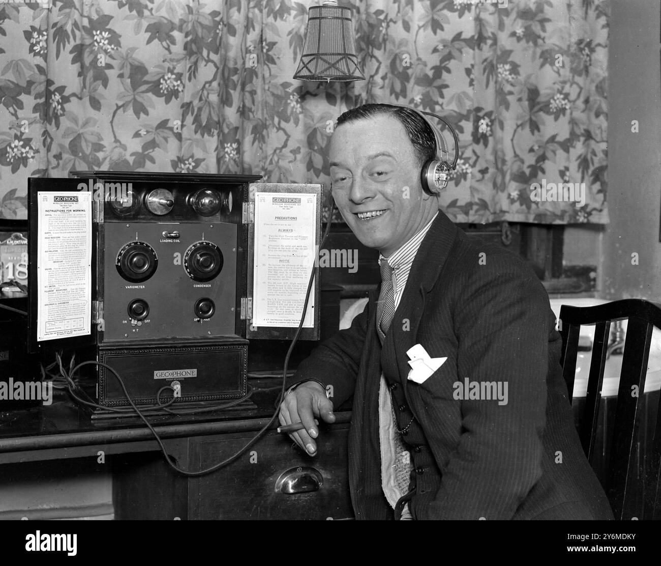 Mr Leslie Henson listens in. 19 March 1923 Stock Photo - Alamy