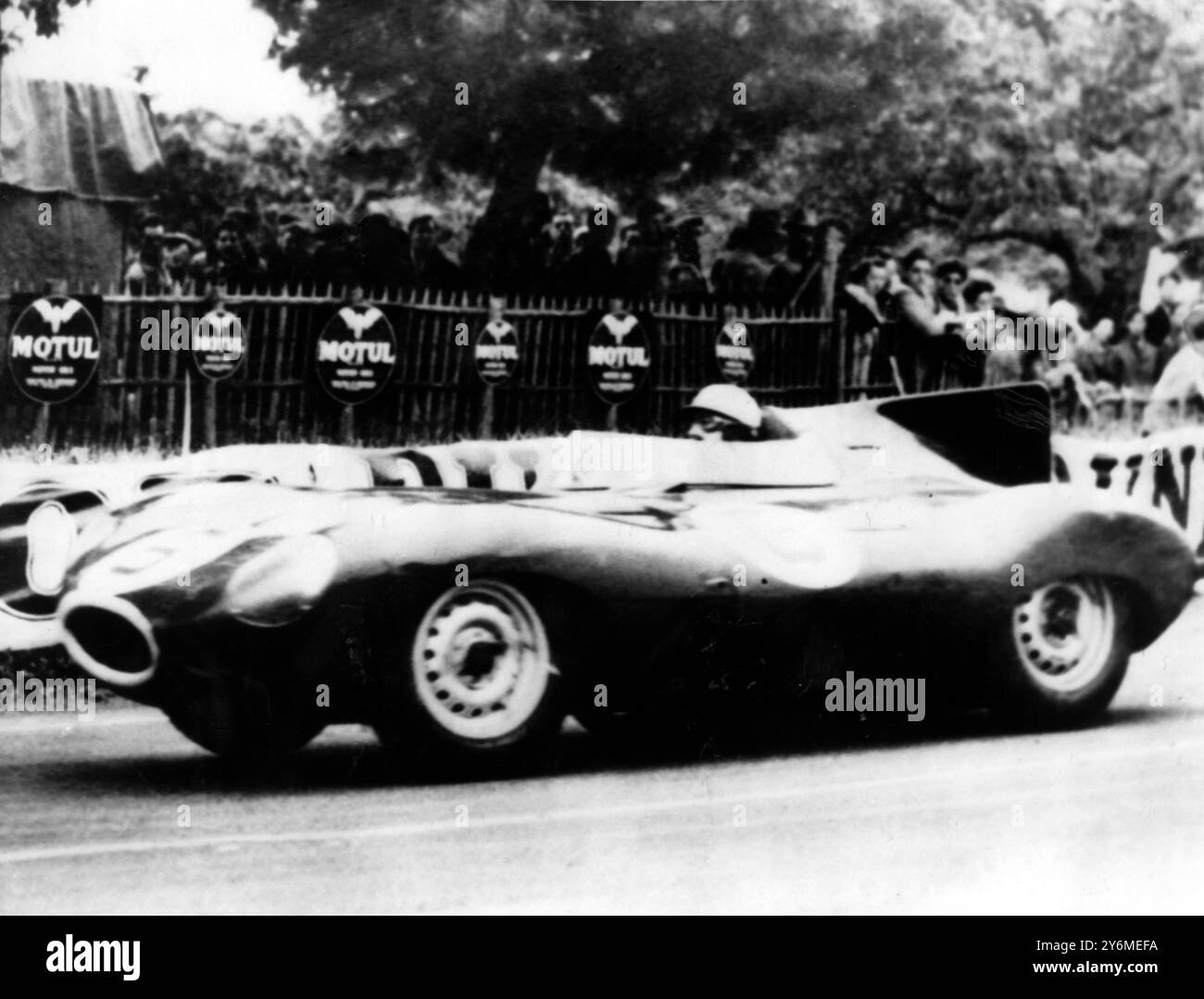 Mike Hawthorn with Ivor Bueb driving the Jaguar no 6 as it leads the 24 ...